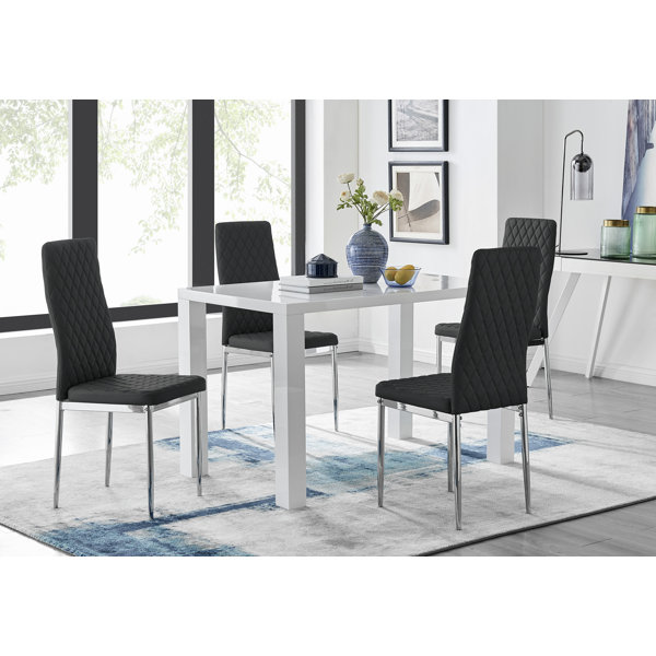 East Urban Home Eubanks High Gloss 4 Seat Rectangular Dining Table Set with Faux Leather ...